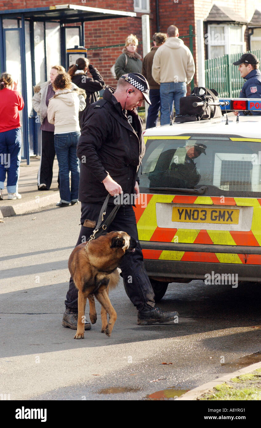 Armed police response units in action at a UK housing estate including ...