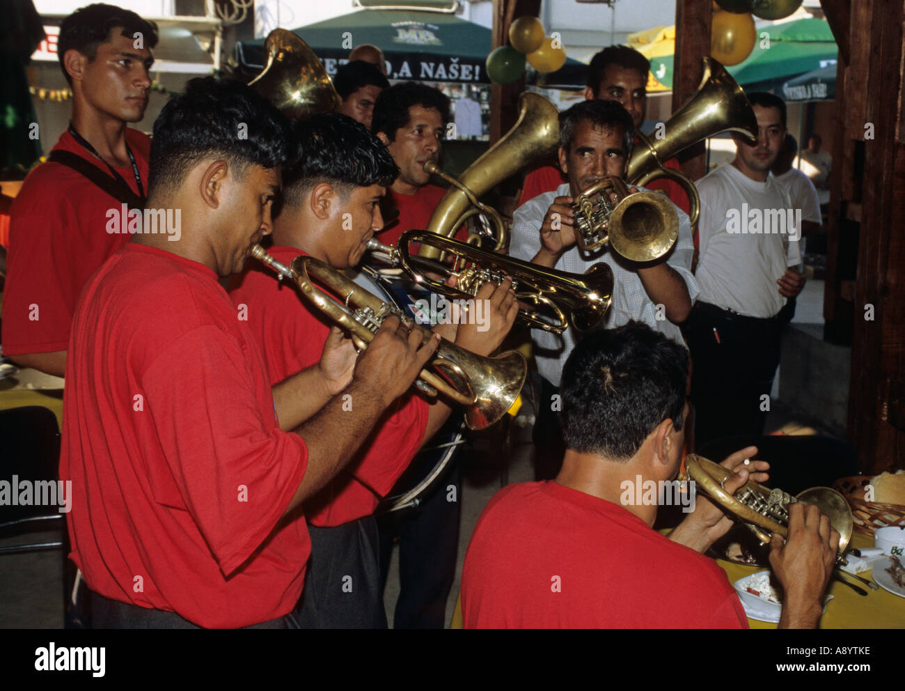 roma gipsies trumpeters playing music in a restaurant at the Guca ...