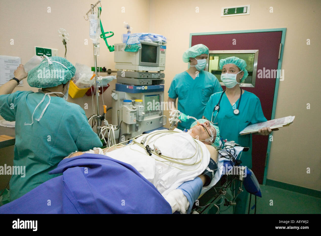 anesthesiologists preparing patient for cancer surgery operating room ...