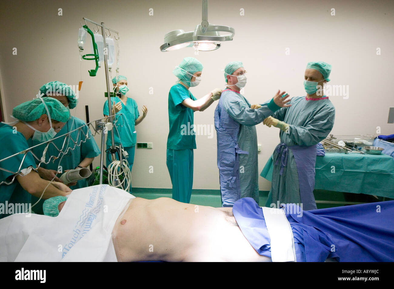 anesthesiologists preparing patient for cancer surgery operating room ...
