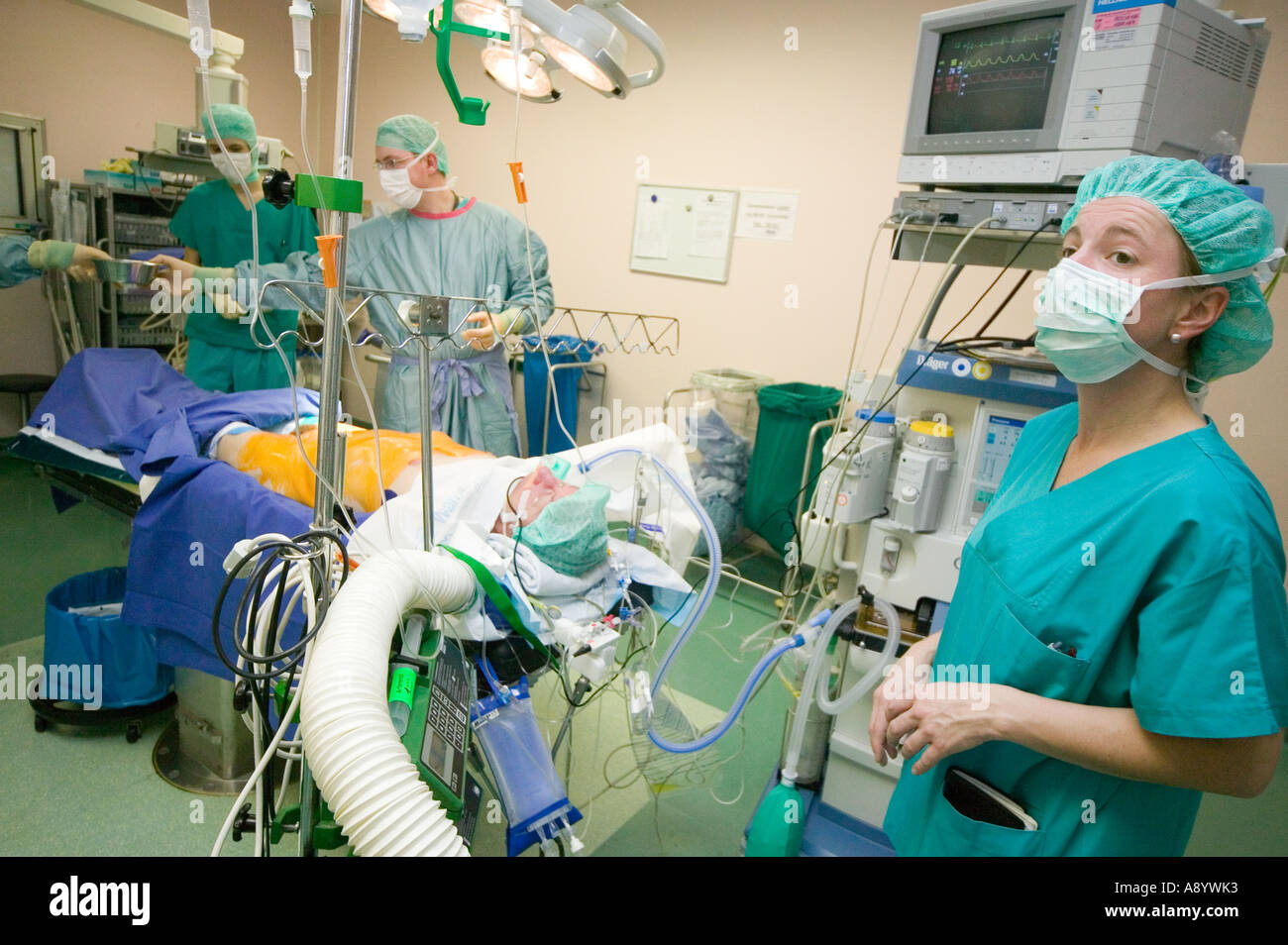 anesthesiologists preparing patient for cancer surgery operating room ...