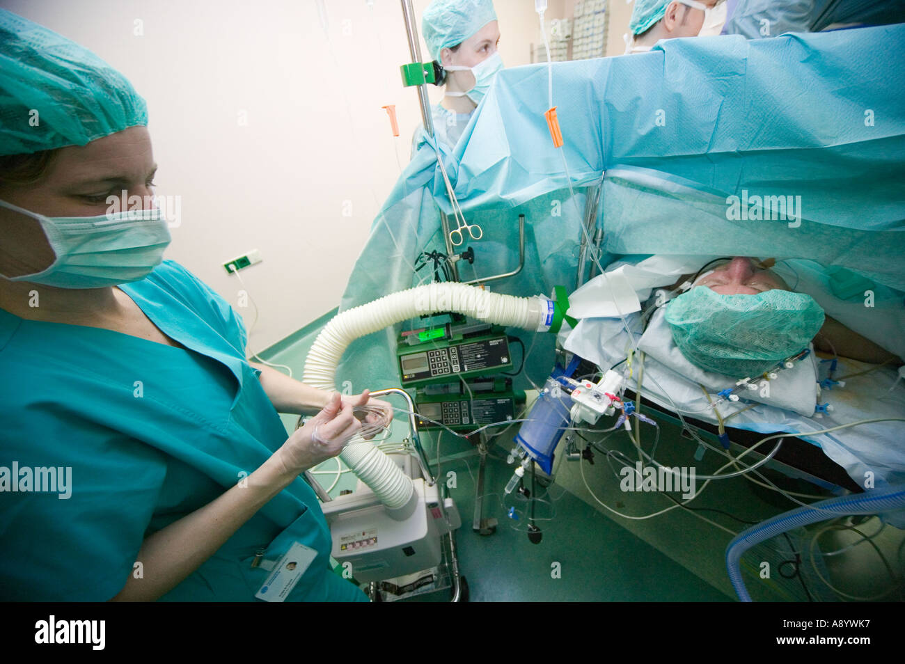 anesthesiologists preparing patient for cancer surgery operating room ...
