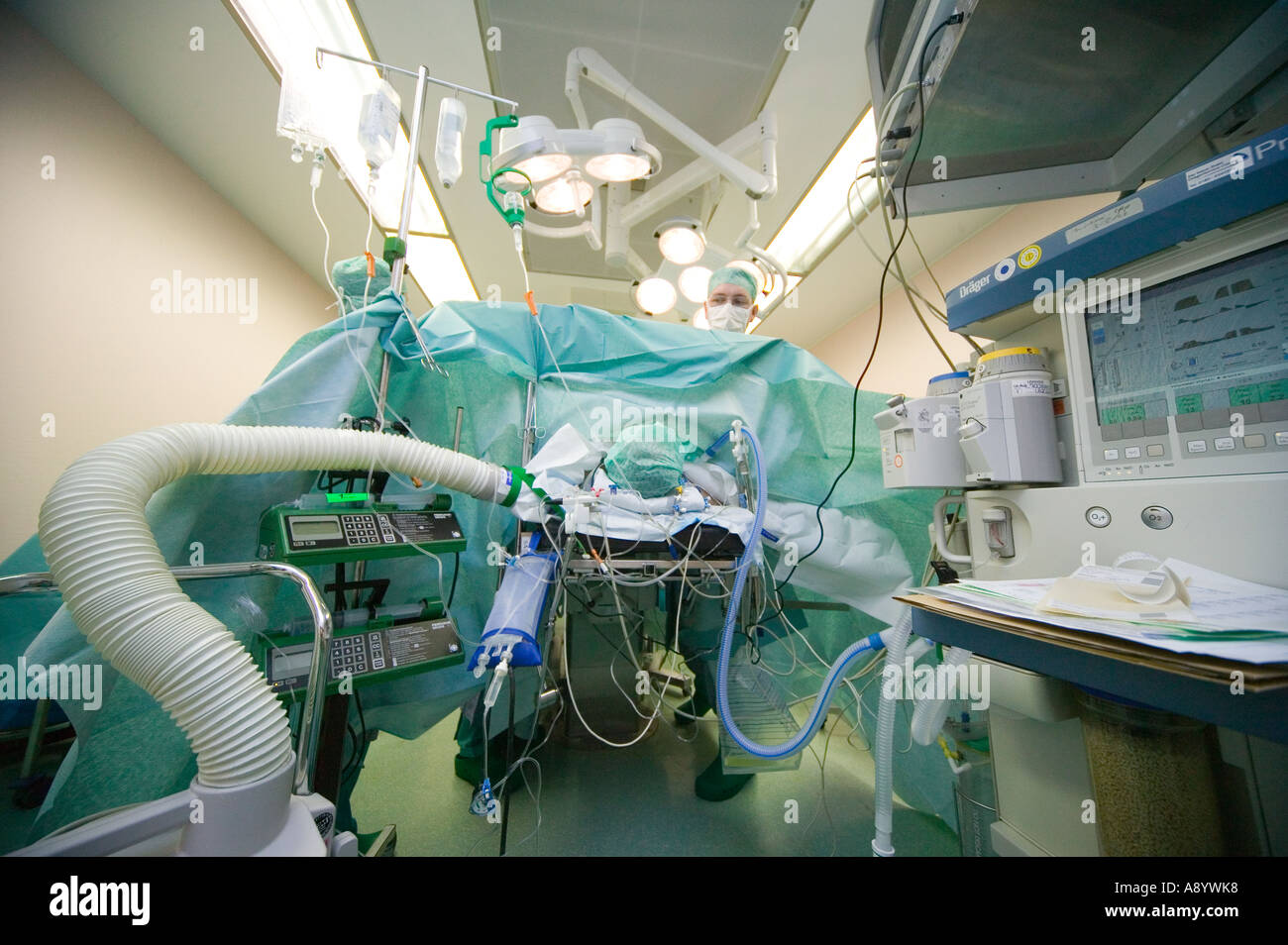 anesthesiologists preparing patient for cancer surgery operating room ...