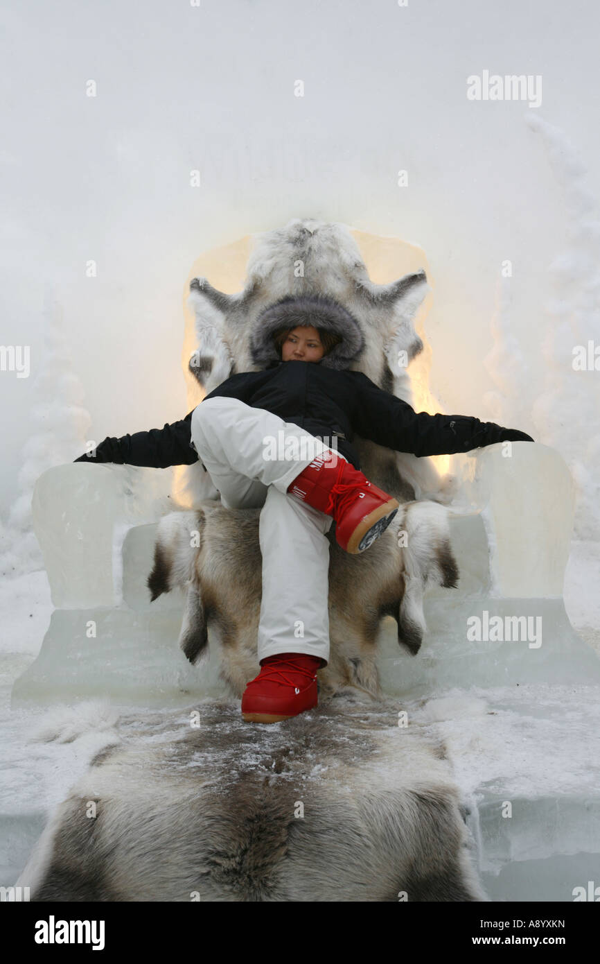 Tourist sitting on ice throne in ice igloo Stock Photo - Alamy