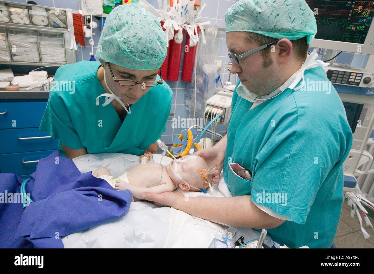 anesthesiologists preparing two month old baby patient for heart ...