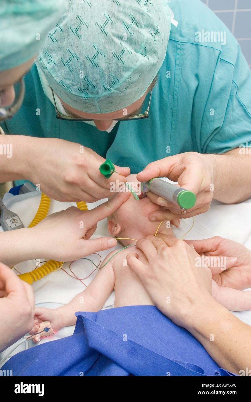 anesthesiologists preparing two month old baby patient for heart ...