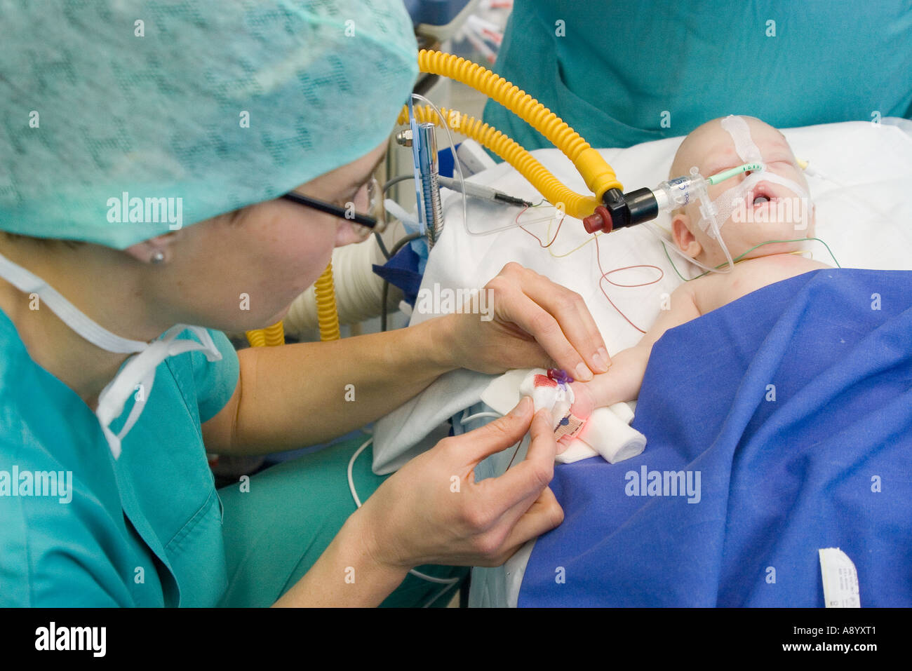 anesthesiologists preparing two month old baby patient for heart ...