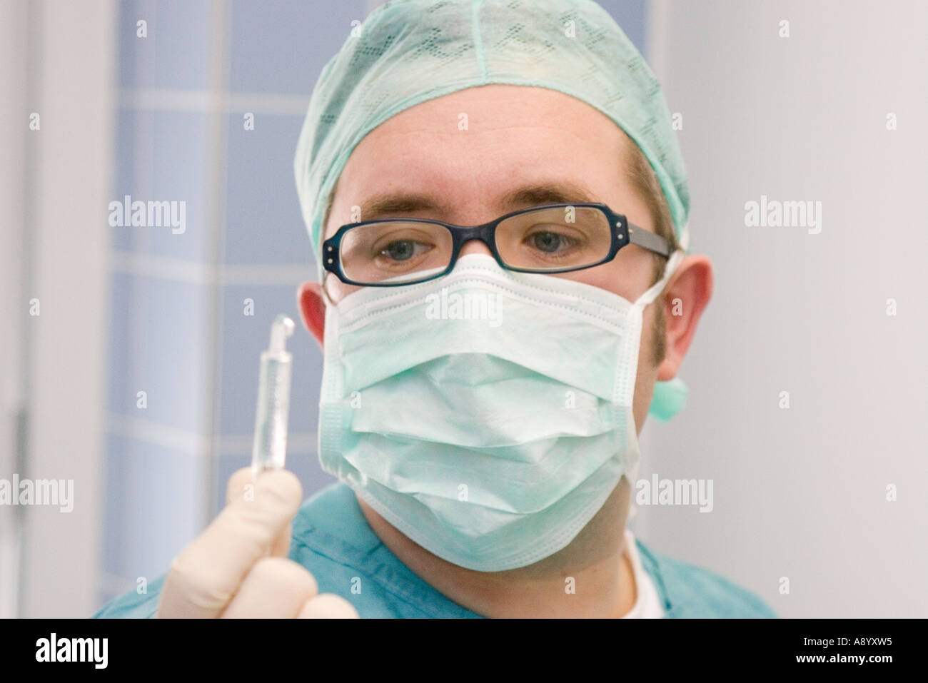 anesthesiologist preparing two month old baby patient for heart surgery ...