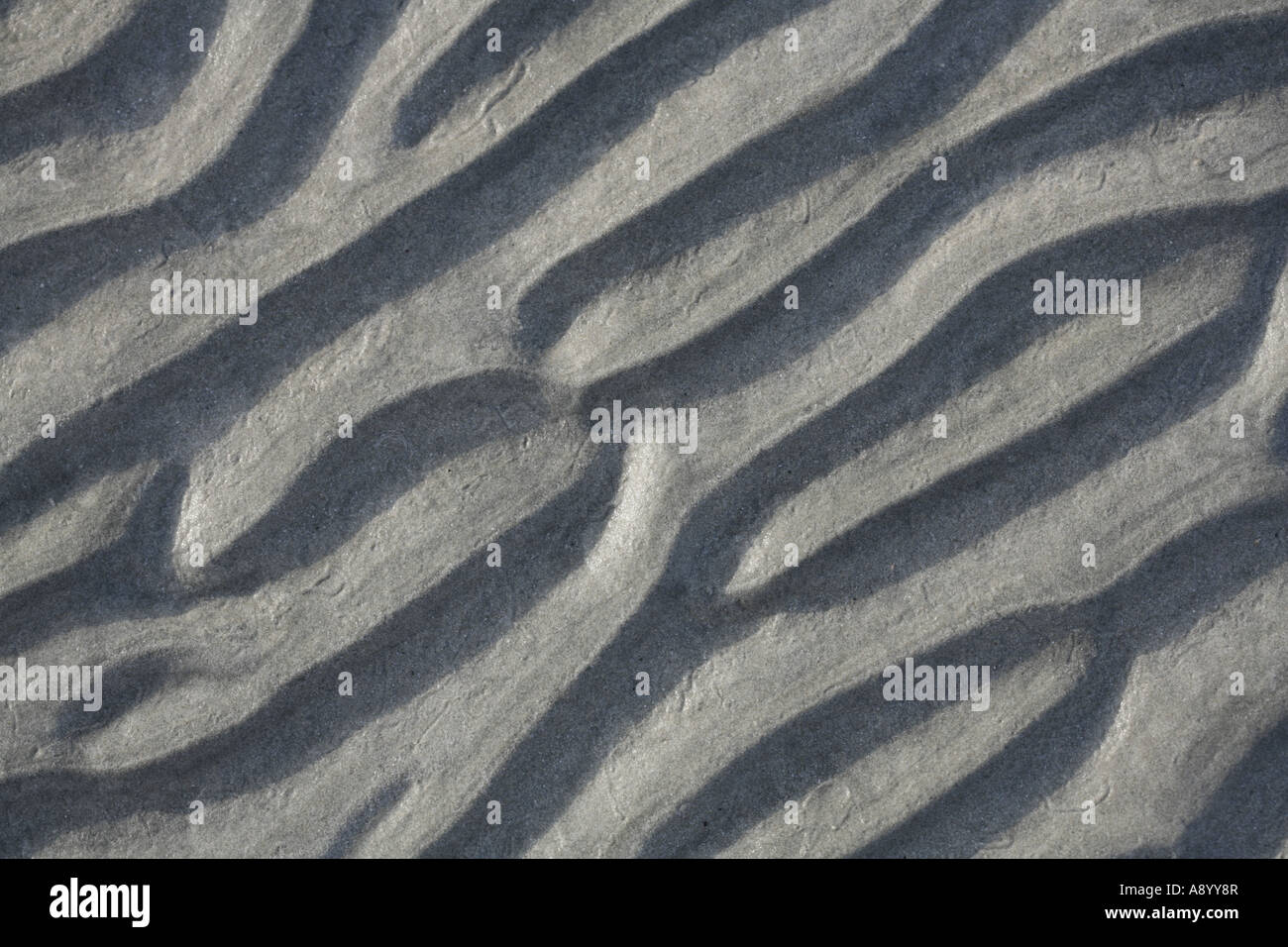 Wet beach sand pattern Stock Photo - Alamy