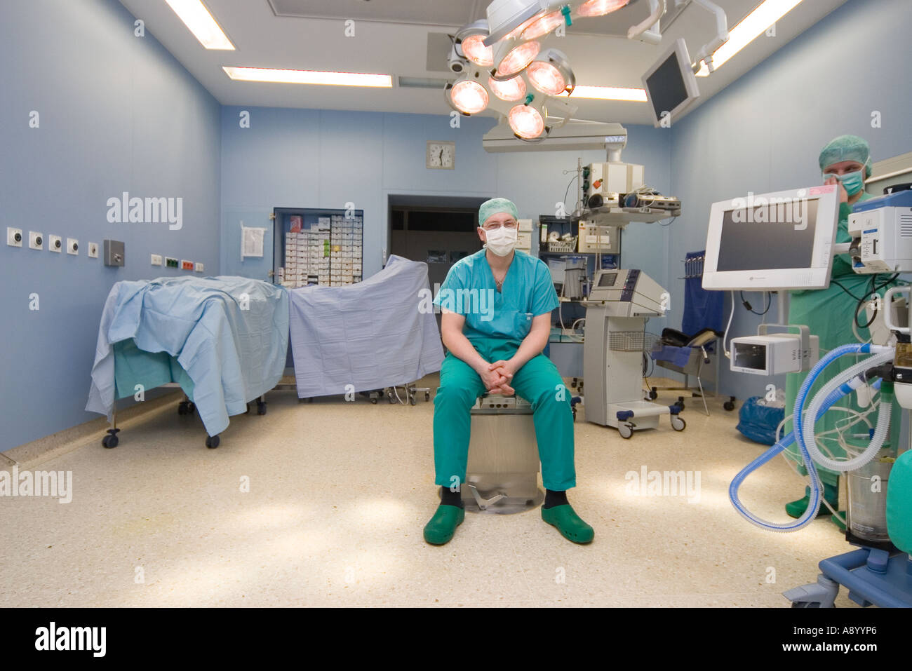exhausted surgeon waiting at night for next surgery patient Stock Photo ...
