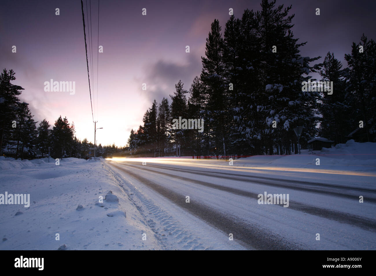 Traffic at dusk along one of Levi's roads in Finnish Lapland Stock ...