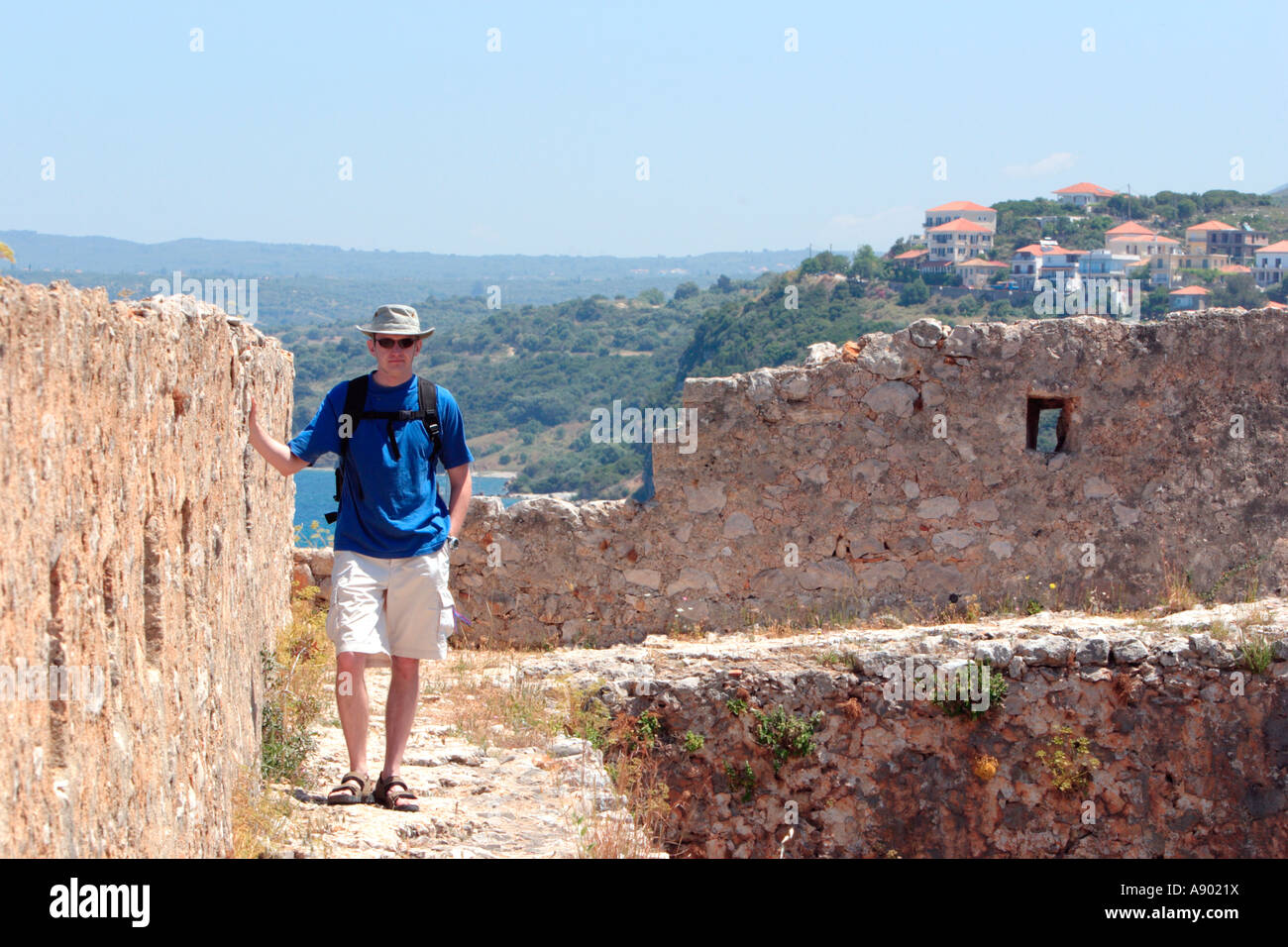 A male tourist on the wall of Neokastro a Turkish fortress in Pylos ...