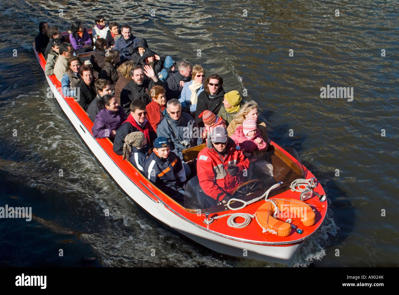 Horizontal aerial view of one of the many guided boat tours full of ...