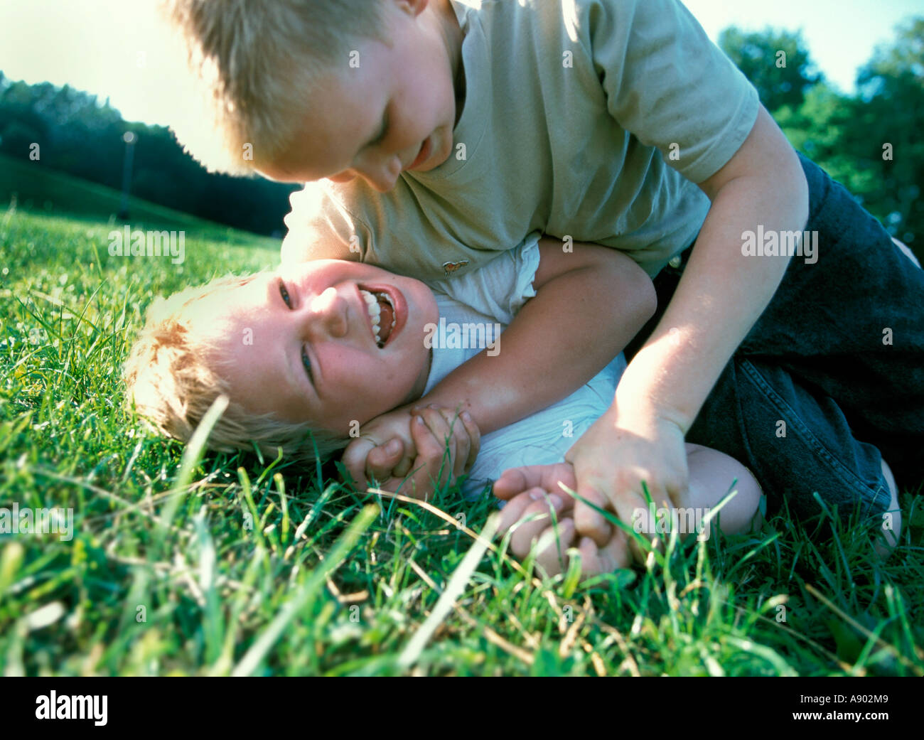Boys fighting playfully hi-res stock photography and images - Alamy
