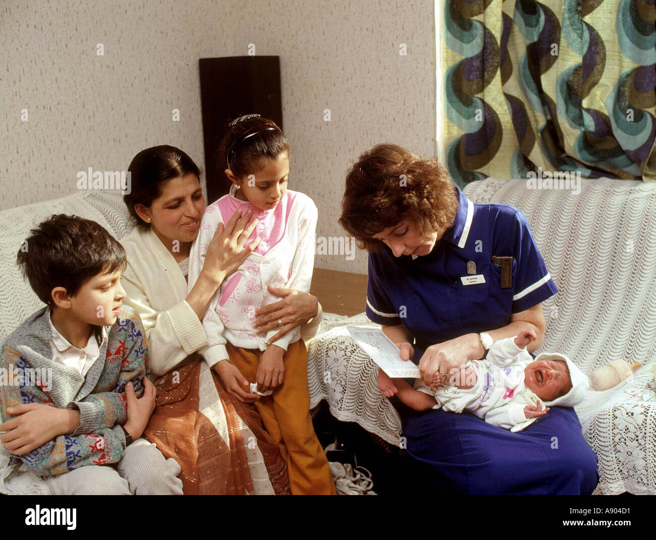 Midwife home visit Stock Photo - Alamy