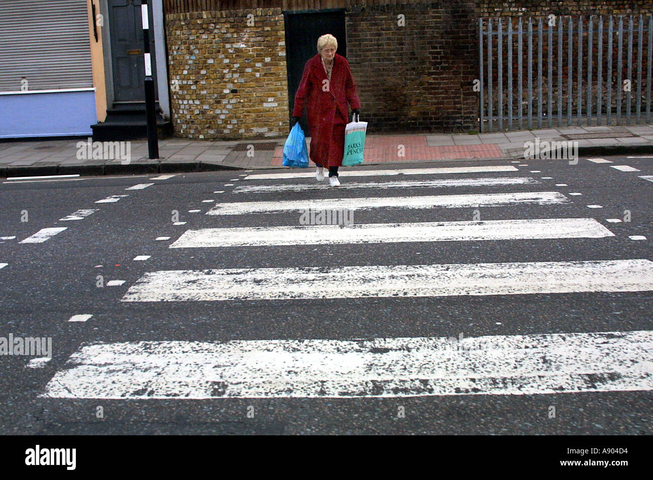 old woman at zebra crossing Stock Photo - Alamy