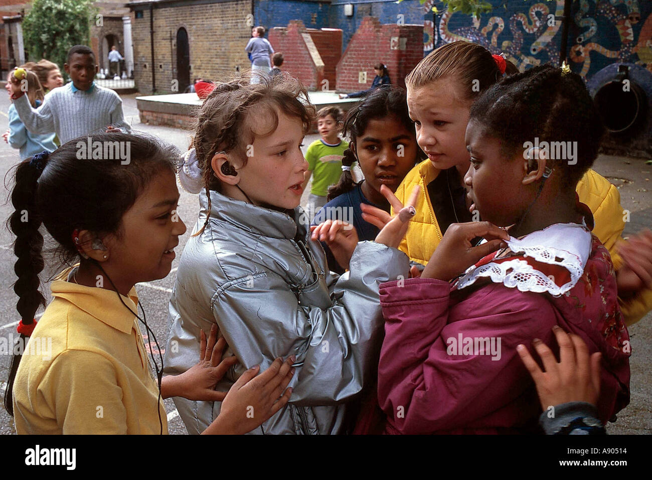 young school children signing in school playground Stock Photo - Alamy