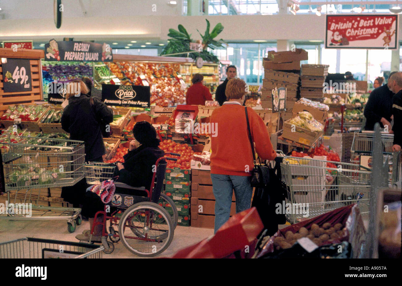 Inside supermarket produce section with people shopping Stock Photo - Alamy