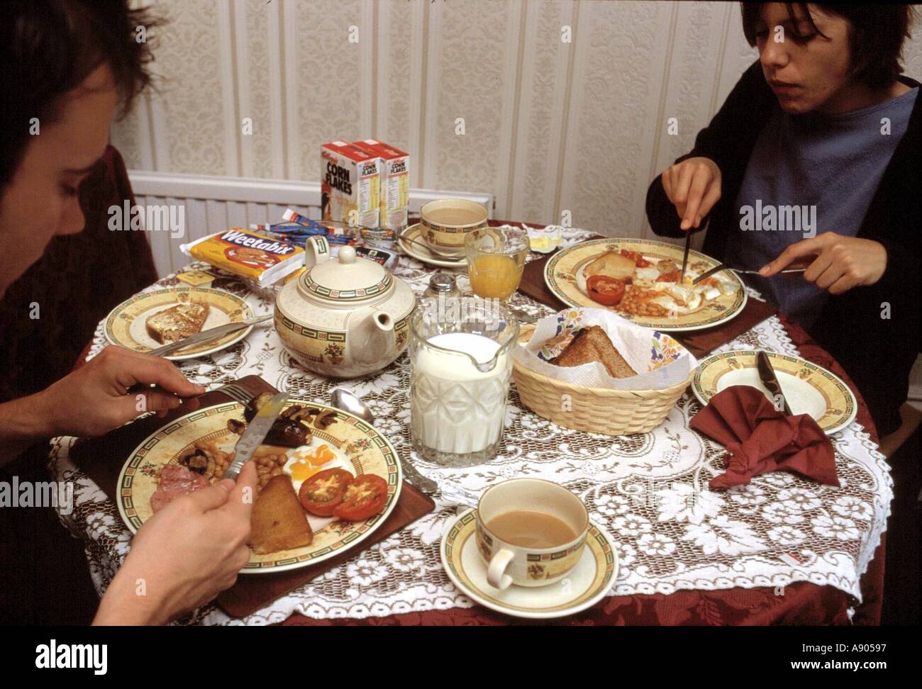 couple eating full english breakfast Stock Photo - Alamy