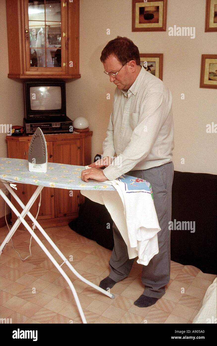 Father ironing clothes hi-res stock photography and images - Alamy