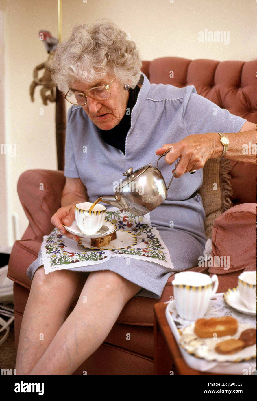 old woman having afternoon tea and cakes at home Stock Photo - Alamy