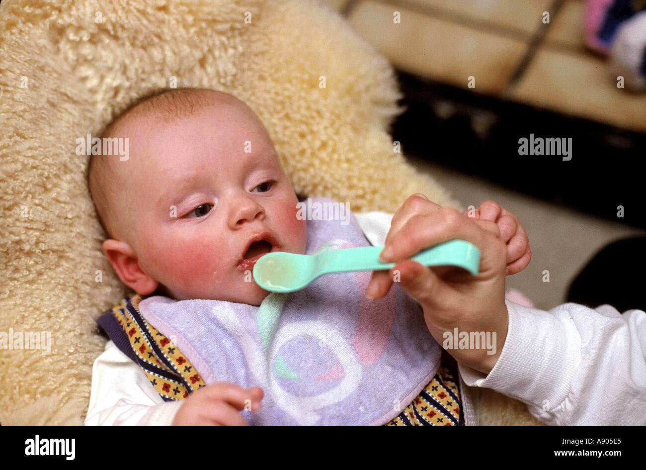 Baby being fed hi-res stock photography and images - Alamy