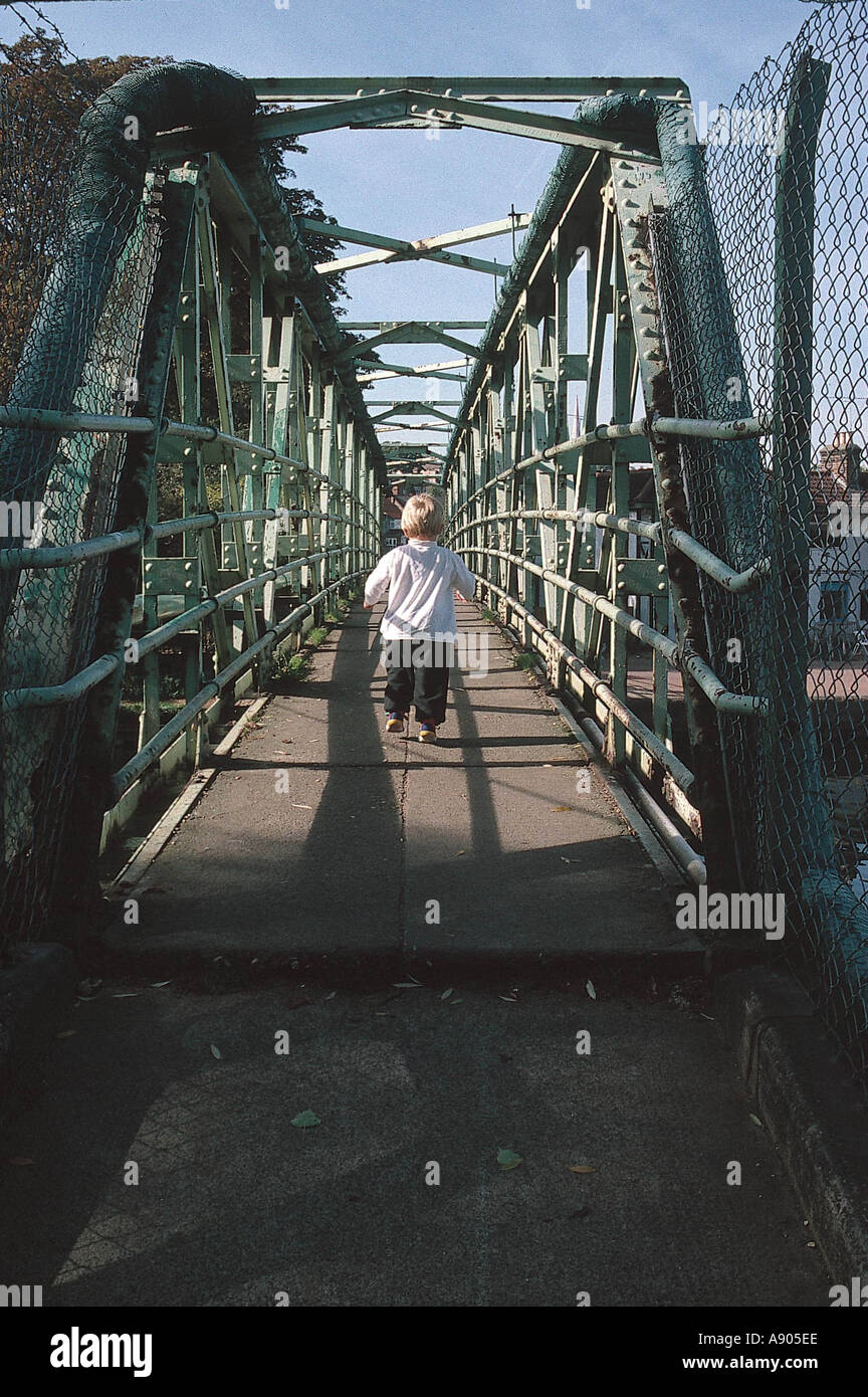 toddler walking over bridge Stock Photo - Alamy
