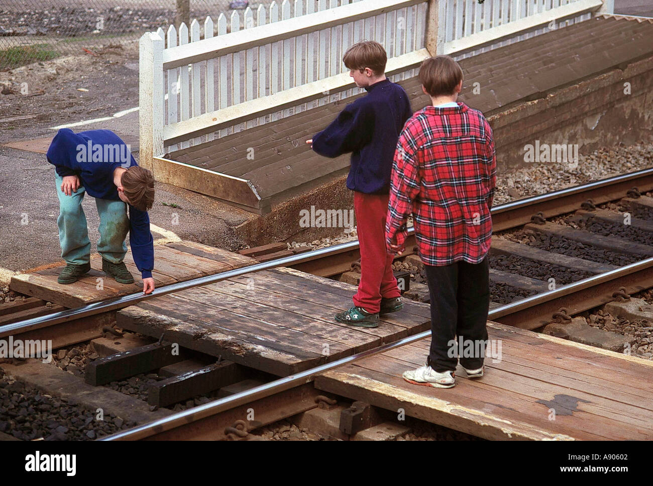children playing on a rail track Stock Photo - Alamy