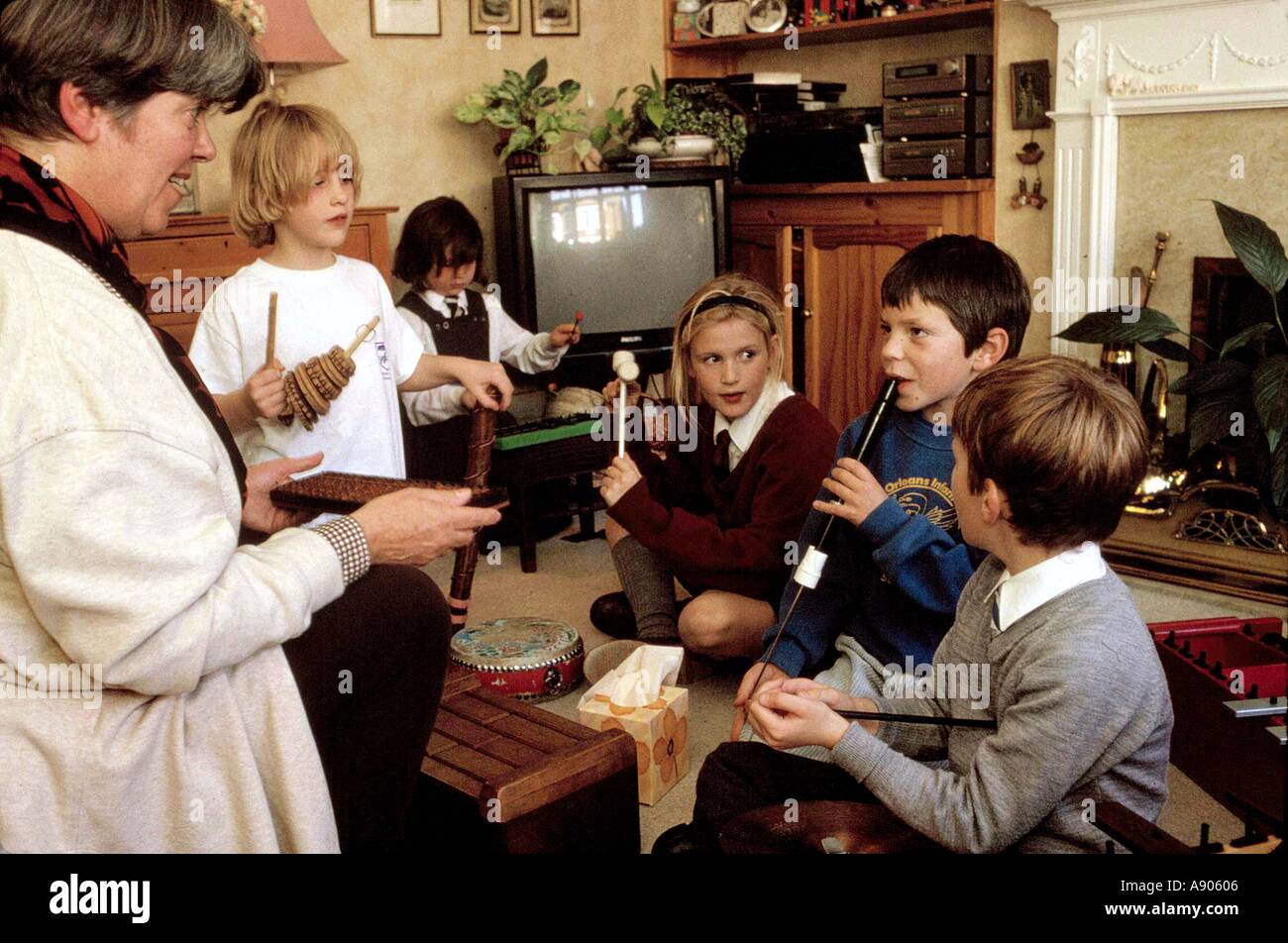 children playing musical instruments in an extra curricular lesson ...