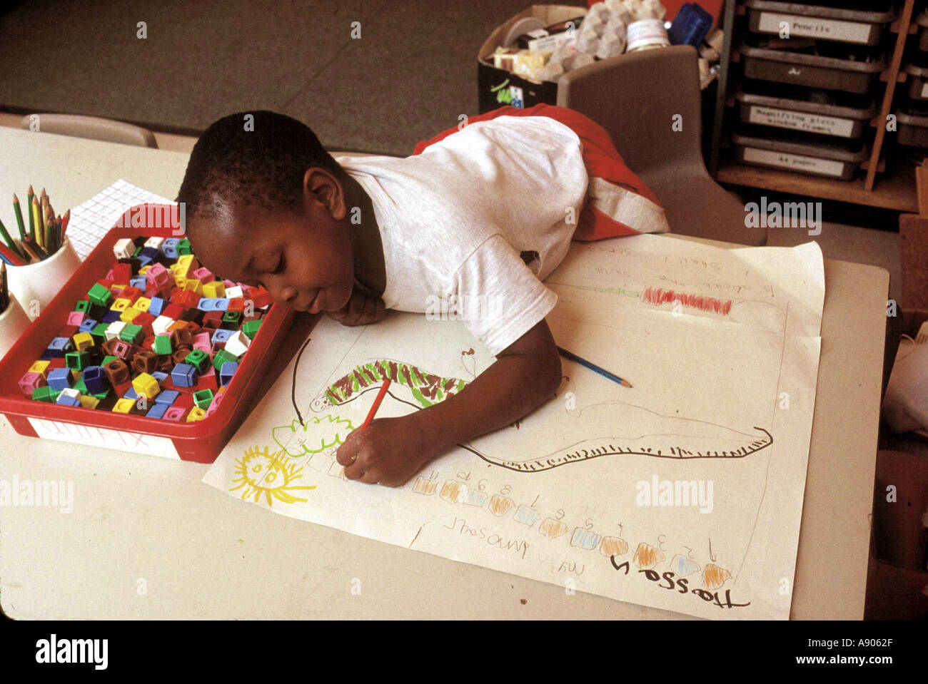 Primary school child drawing a picture Stock Photo - Alamy