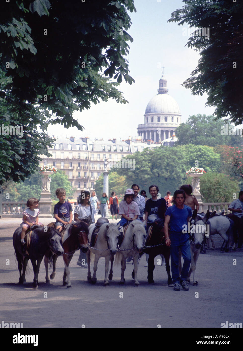 Paris, Luxembourg Gardens and Pantheon. Children on ponies Stock Photo ...