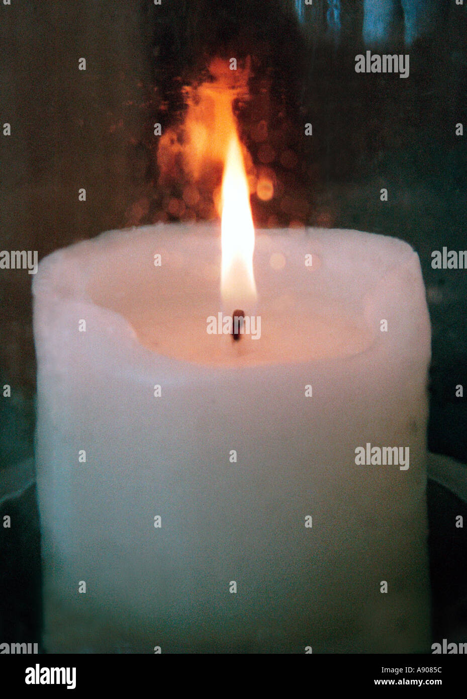 diffused White Candle With Flame Stock Photo - Alamy