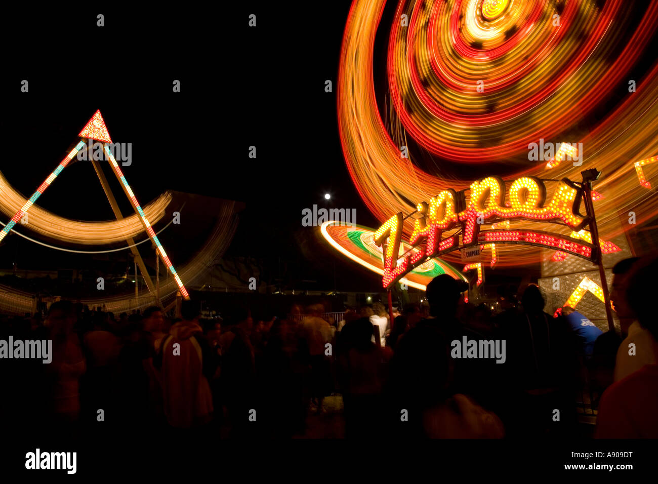 Carnival rides at night Stock Photo - Alamy