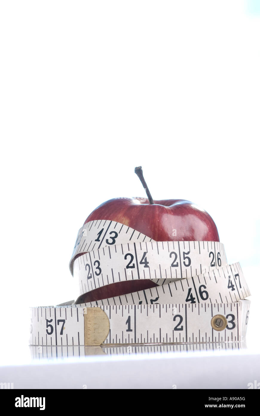 Apple with tape measure Stock Photo - Alamy