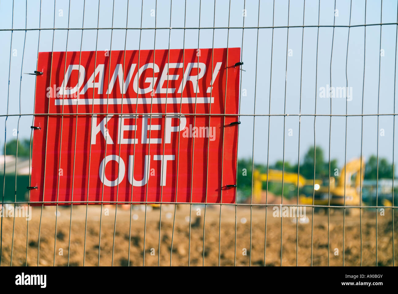A Warning Sign - Danger Keep Out. Construction Machinery In The ...