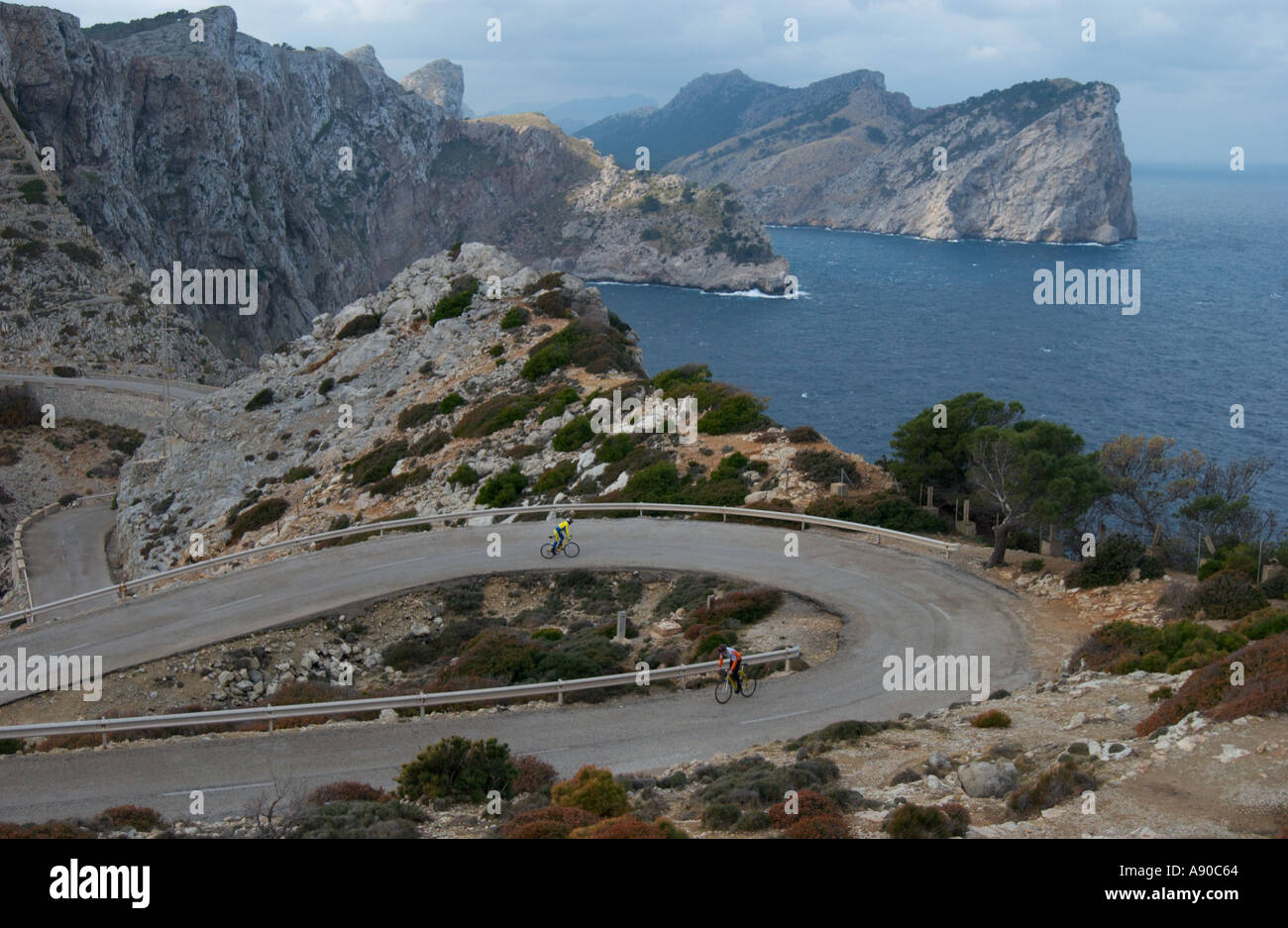 Cyclists on the access road to the Lighthouse at Cap Formentor ...