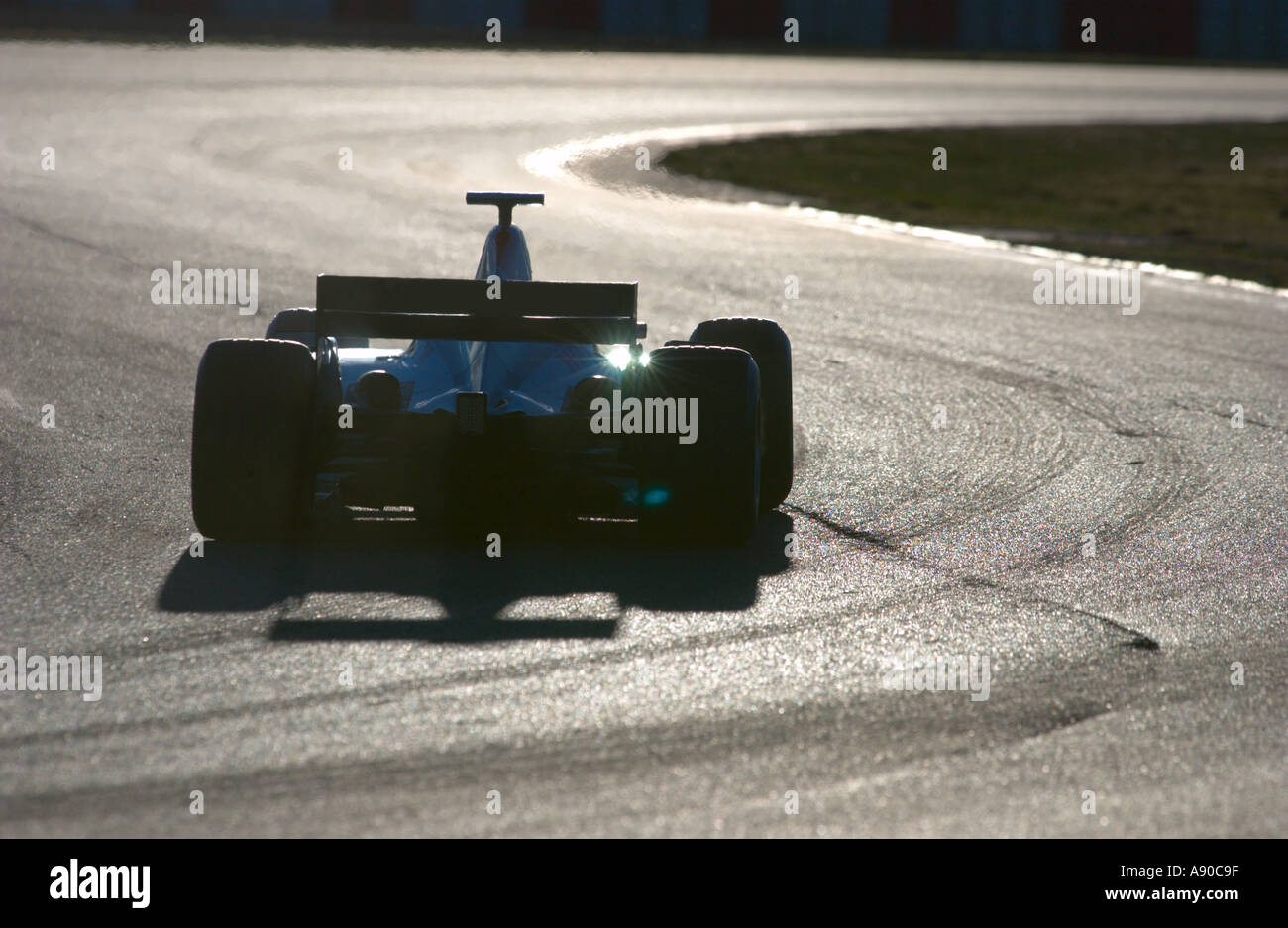 Formula One racing car speeding down the track Stock Photo - Alamy