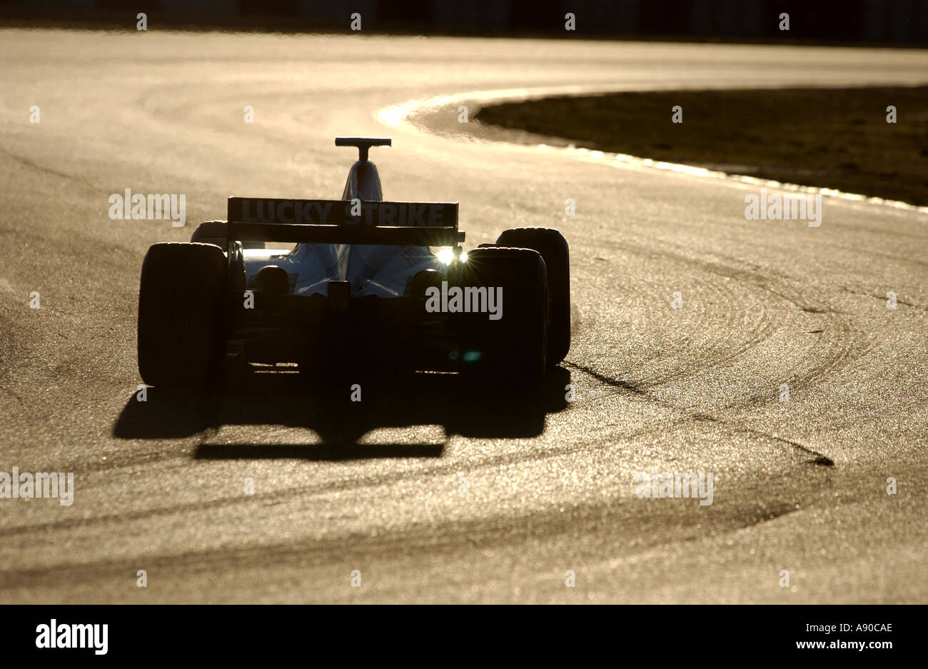 Formula One Racecar on the track seen from behind Stock Photo - Alamy