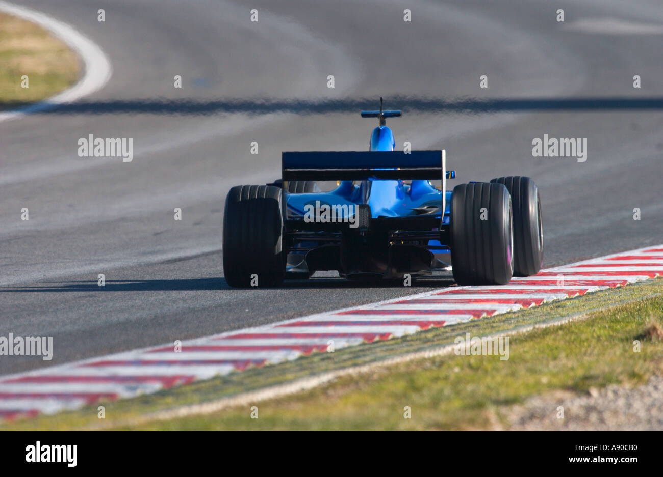 blue Formula One racing car speeding down the Track Stock Photo - Alamy