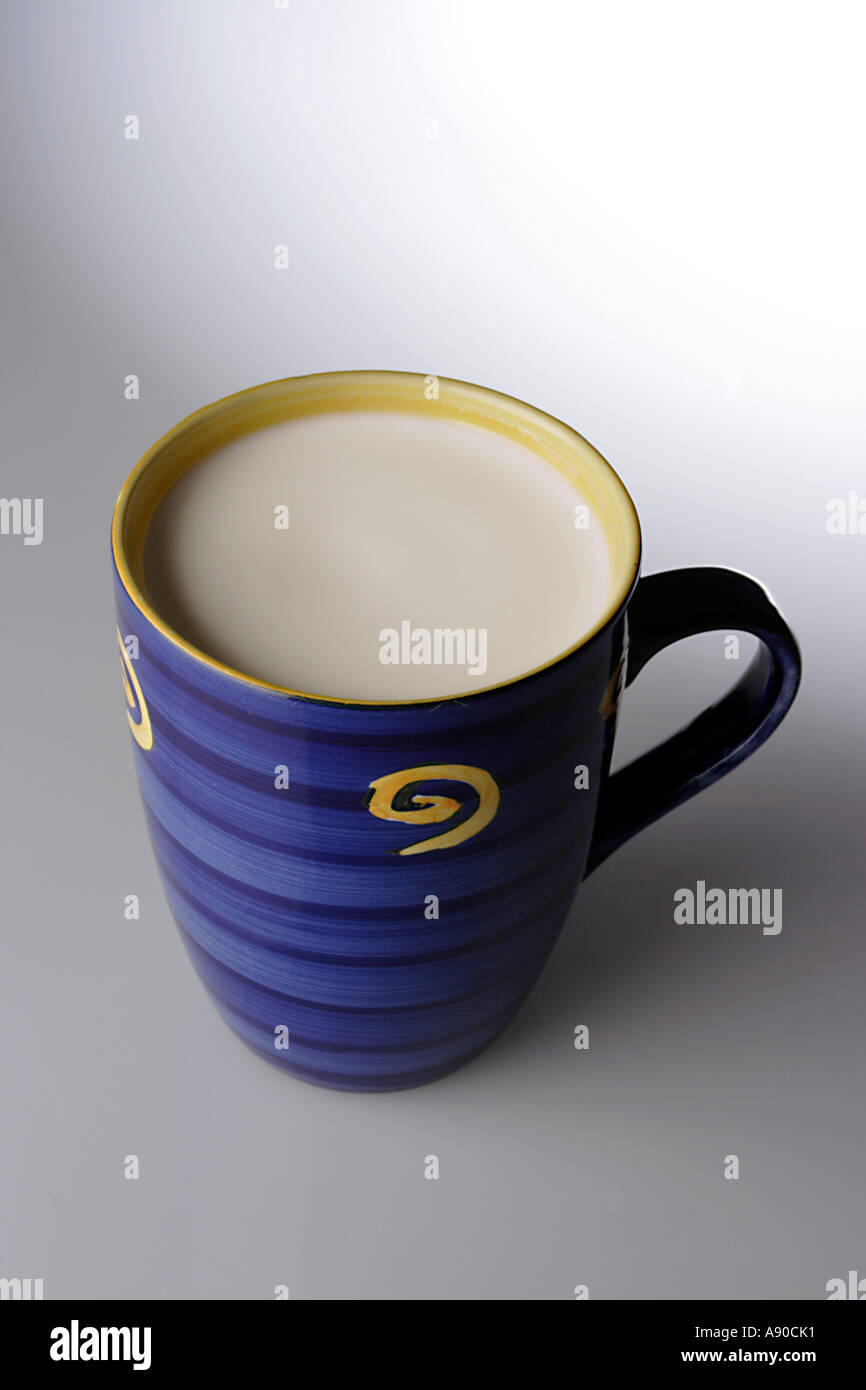 VDA78113 Top angle of healthy drink milk in ceramic cup blue color ...