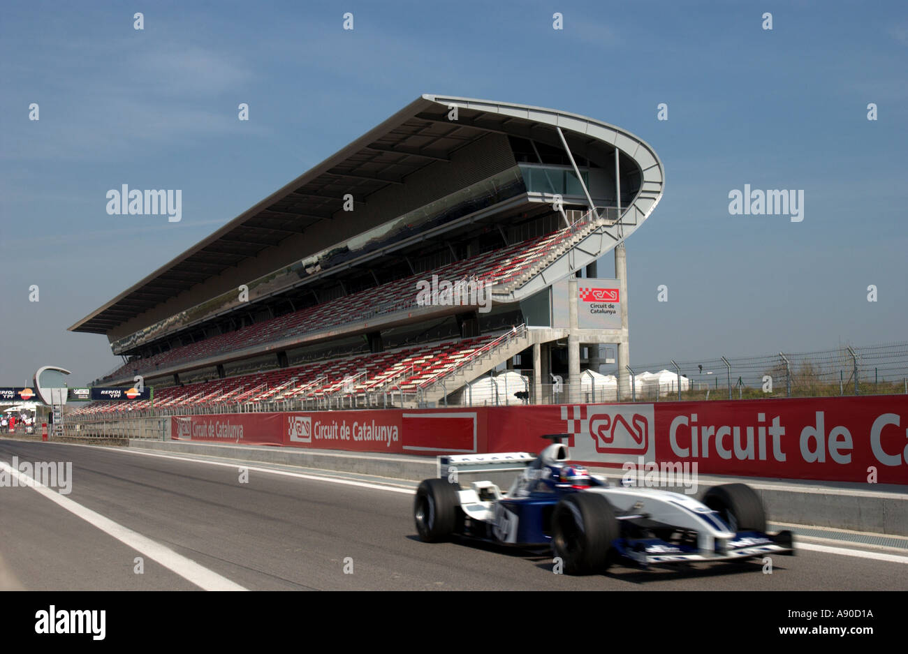 BMW Williams Formula 1 car speeding out of pit lane in front of the ...
