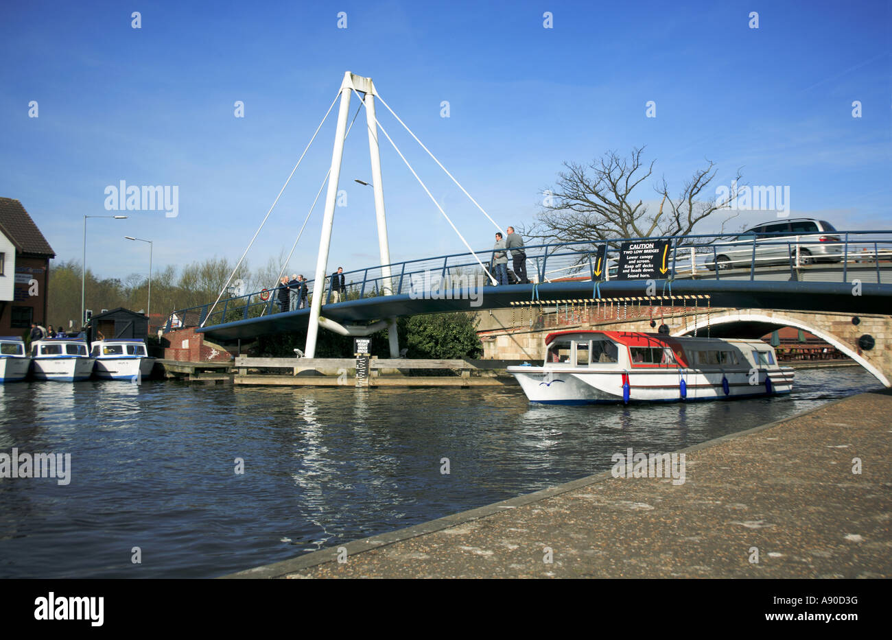 Pedestrian and road traffic bridges crossing the River Bure on the ...