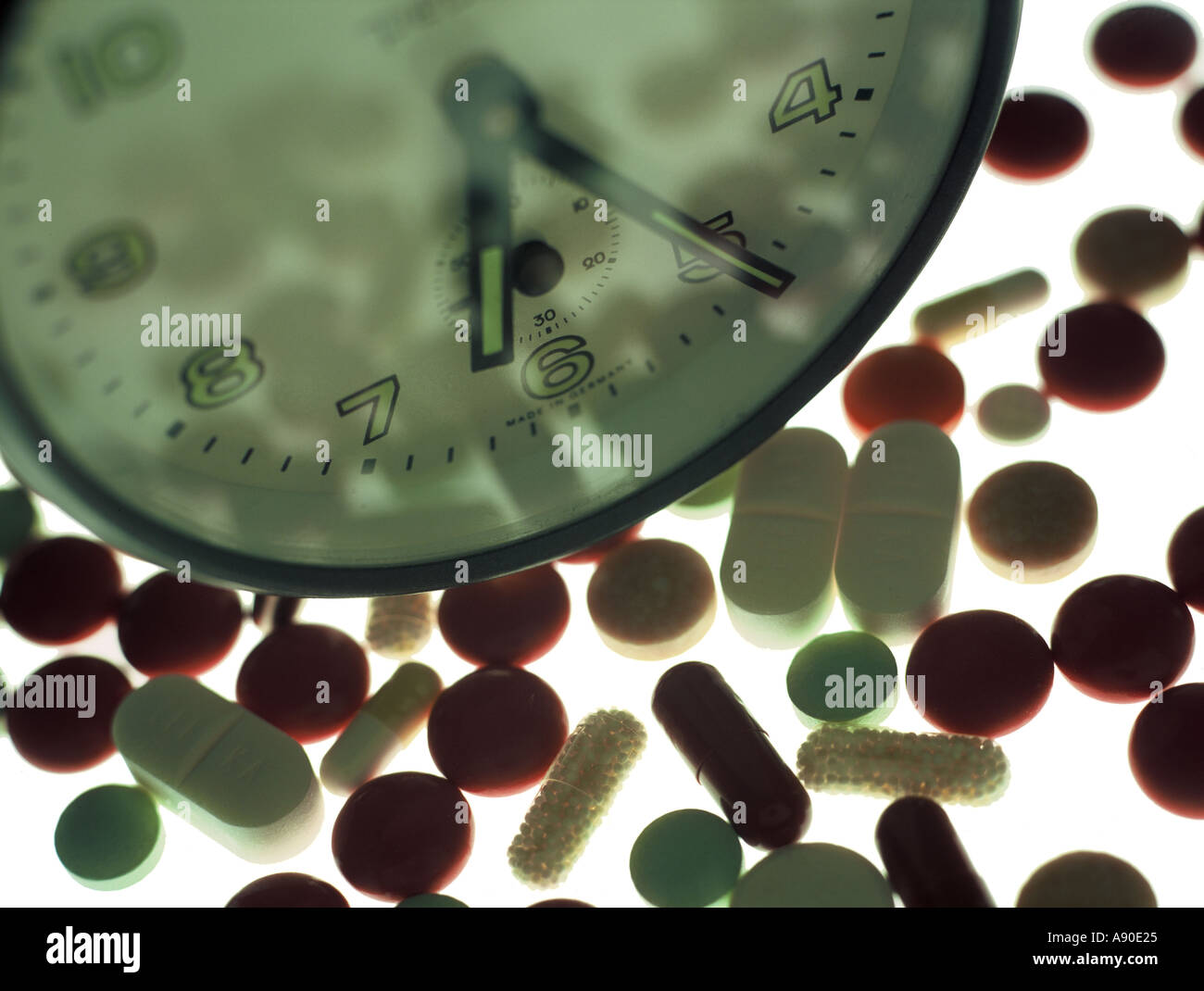 Medicaments and alarm clock Stock Photo - Alamy