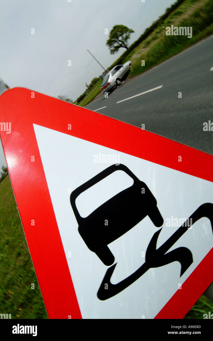 road safety road sign slippery road crash car friction tyres concept ...