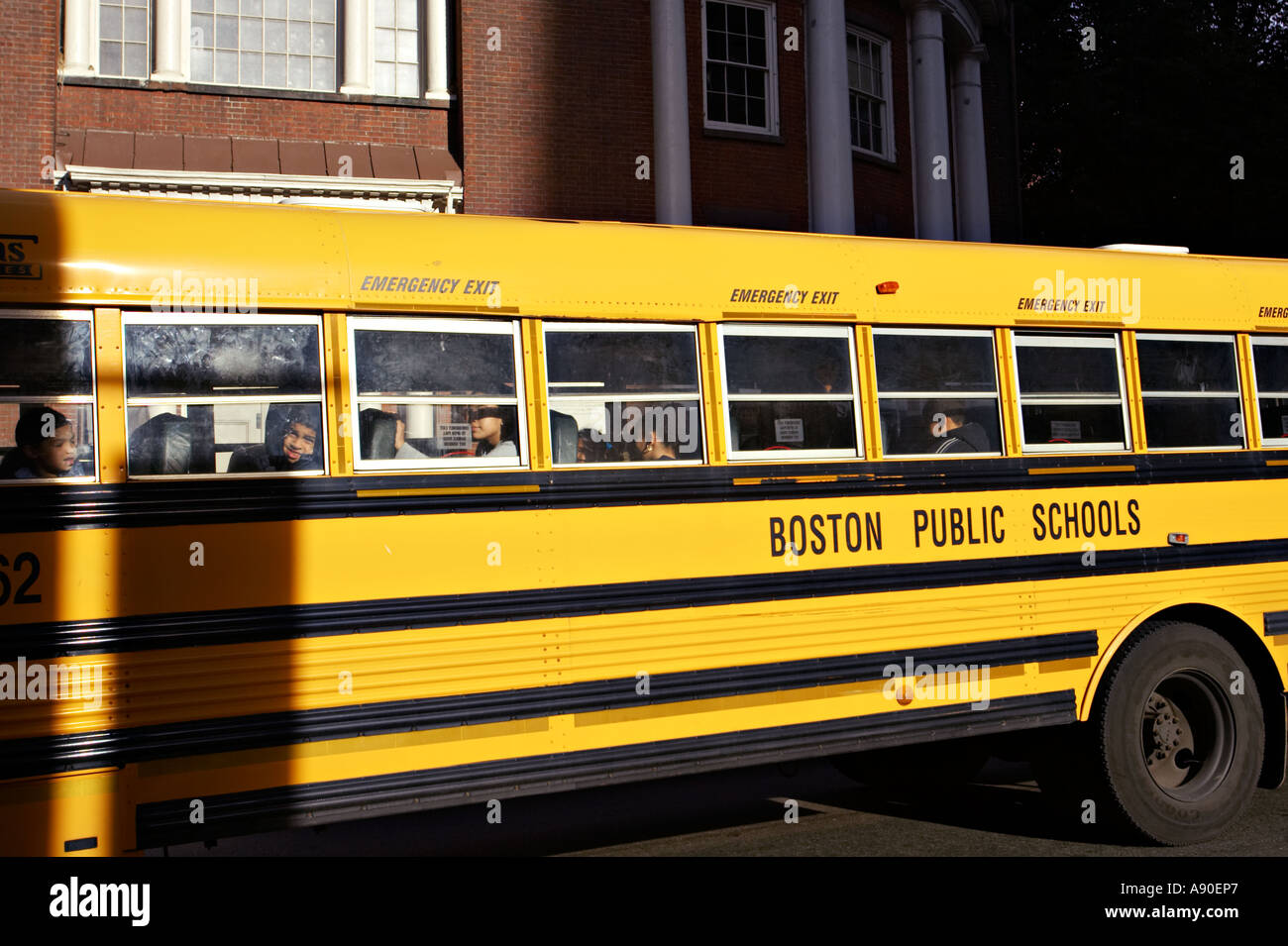MASSACHUSETTS Boston Yellow public school bus on morning route downtown ...