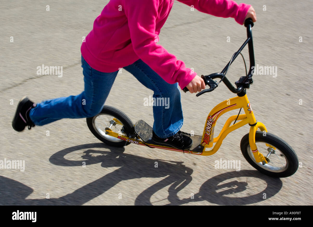Riding a scooter Stock Photo - Alamy