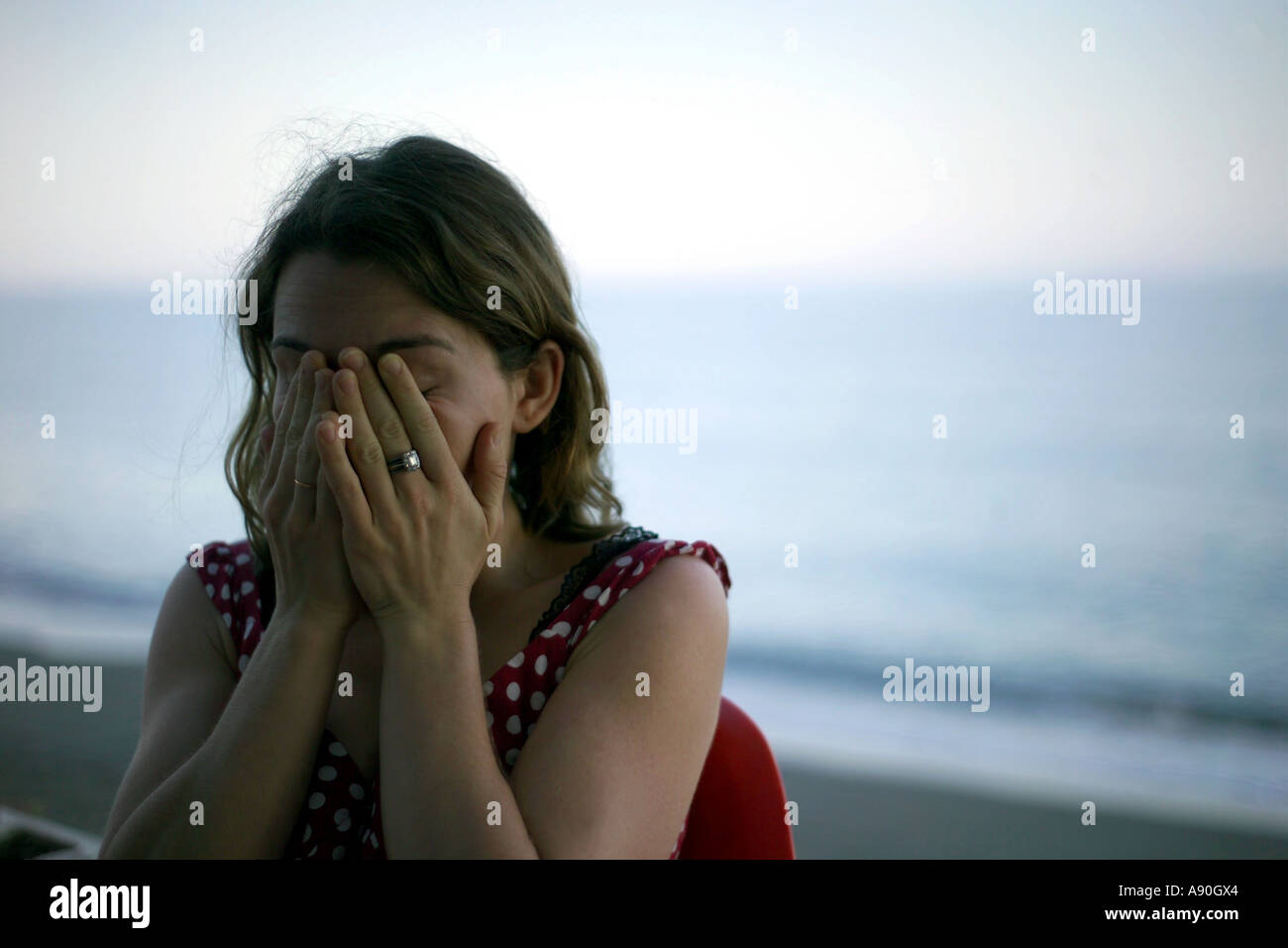 Women crying disaster hi-res stock photography and images - Alamy