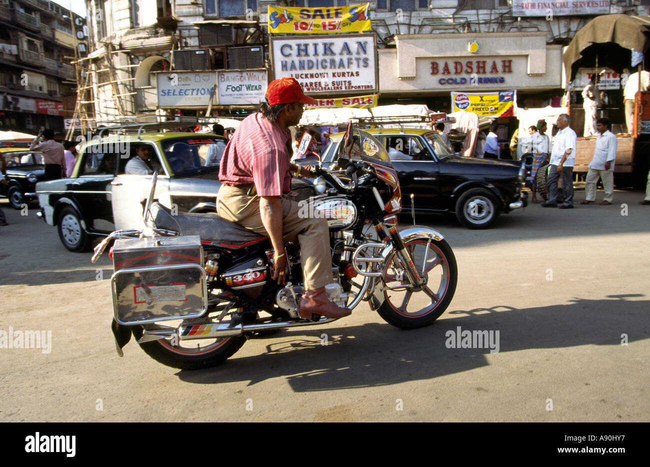 India Maharashtra Mumbai Bombay man on 350cc Enfield Bullet motorcycle ...