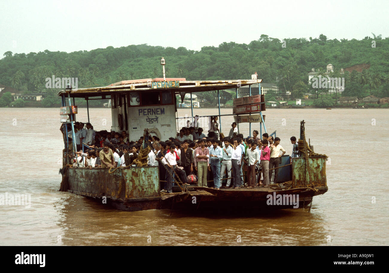 India Goa Panaji transport overloaded ferry coming into dock Stock ...
