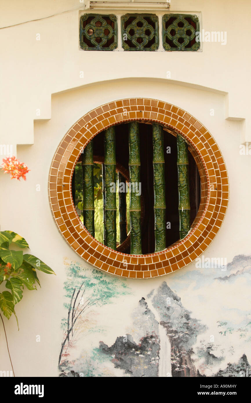 façade of Buddhist temple with round window Stock Photo - Alamy